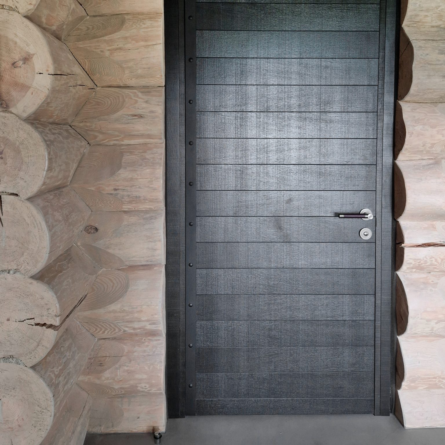 Turnstyle Designs Crafting harmony in unique log house interior ...