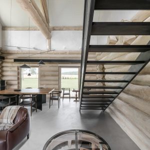 Turnstyle Designs Crafting harmony in unique log house interior ...